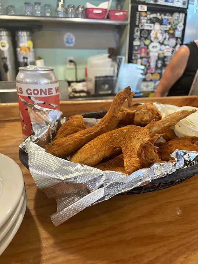 Crispy wings lined up in their basket like edible soldiers, ready to march straight into your happy belly.