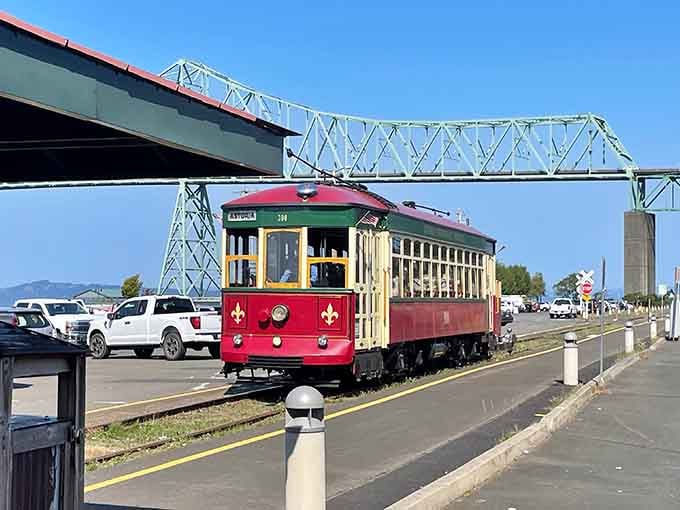 The Astoria-Megler Bridge towers overhead as the trolley glides beneath, connecting past and present perfectly.