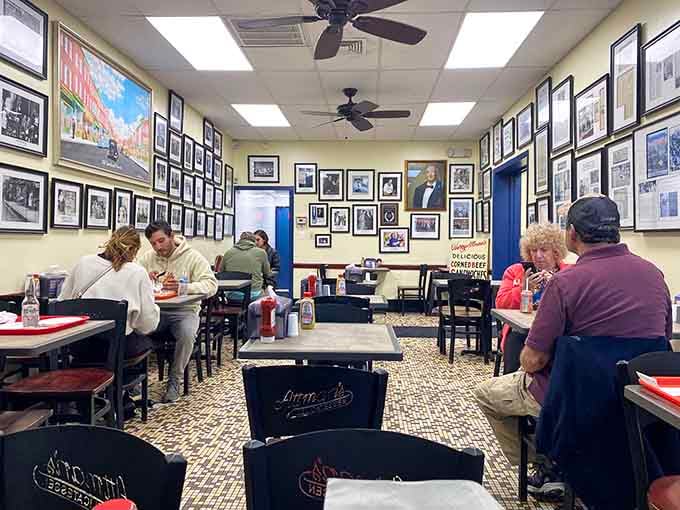 Real people enjoying real food in a space where conversation flows as freely as the mustard on sandwiches.