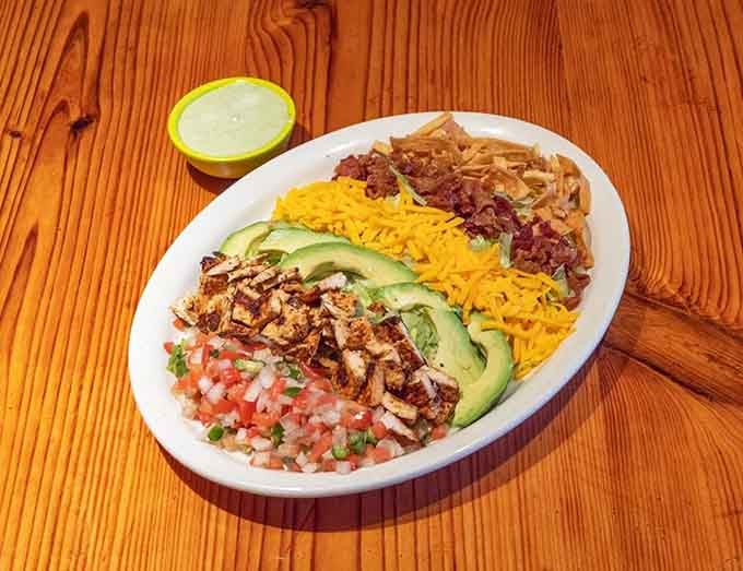 A Mexican Cobb salad brings together avocado, cheese, and beans in a colorful arrangement that's almost too pretty to eat.