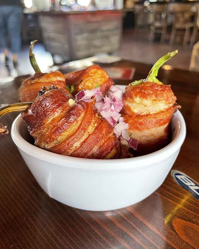 Bacon-wrapped jalape&ntilde;os stuffed with cheese are basically little flavor bombs waiting to explode with deliciousness.