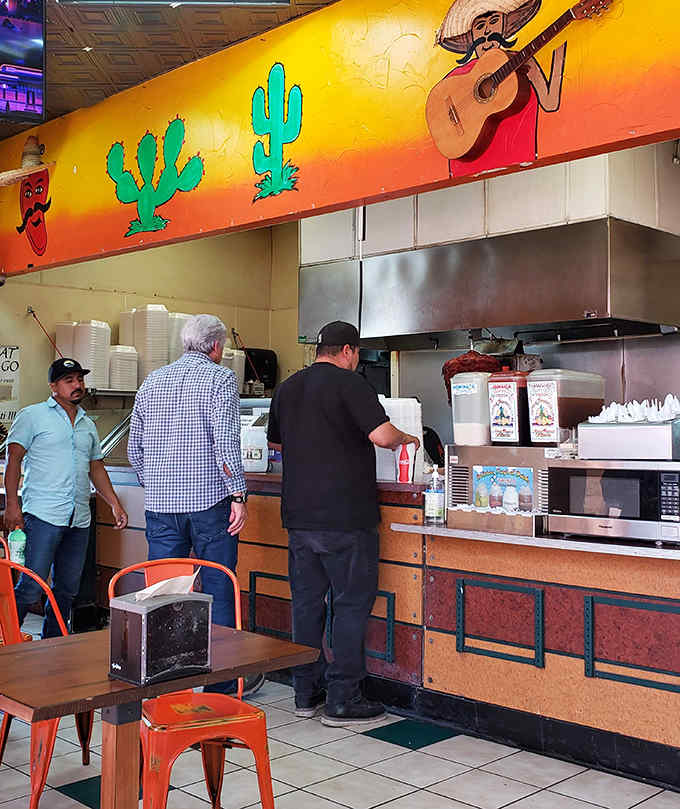Real customers ordering real food in a real gas station, proving that authenticity doesn't need a fancy zip code.