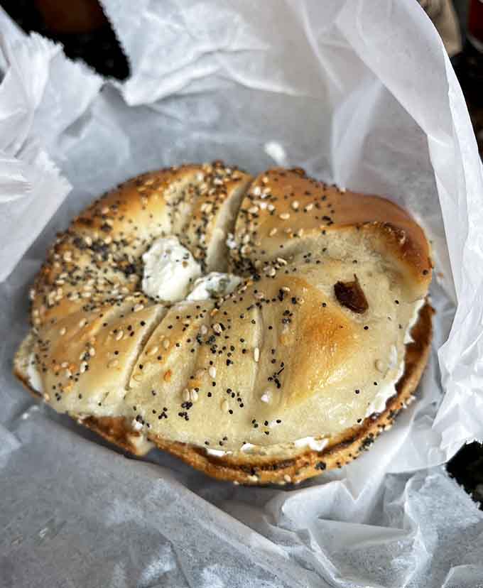 Bacon, egg, and cheese on a poppy seed bagel: the holy trinity of breakfast, executed to perfection.