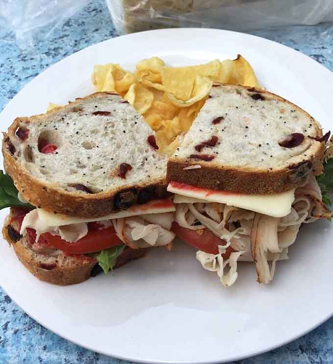 Cranberry bread elevating a turkey sandwich from ordinary lunch to something worth photographing before eating.