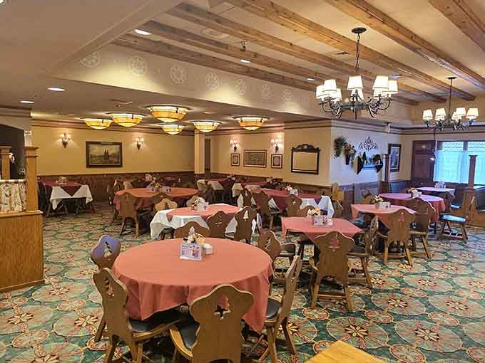 Salmon-colored tablecloths and carved wooden chairs set the stage for meals that become cherished family memories.