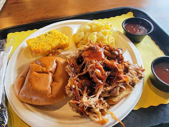 Pulled pork piled high on a bun, ready to make your afternoon infinitely better than planned.