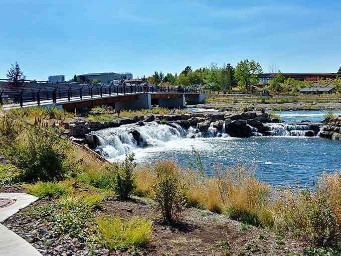 The Old Mill District's waterfall feature, because apparently regular shopping centers weren't scenic enough for Bend's standards.