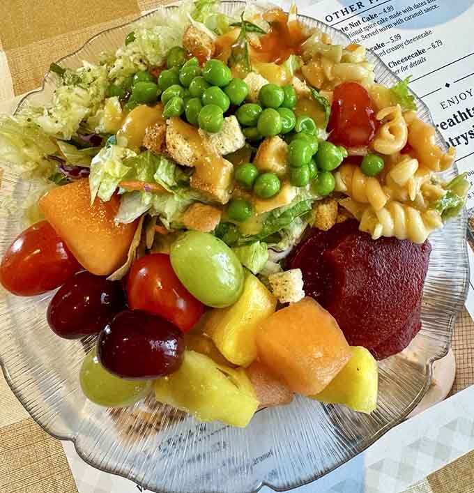 The salad plate that makes you feel virtuous before you return for round two at the dessert table.