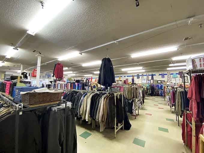 Clothing racks stretching into the distance like a fabric forest where every tree costs practically nothing.