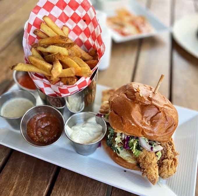 That golden grouper sandwich with crispy fries is comfort food that actually earned the title.