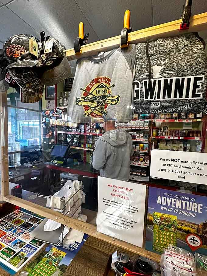 The checkout counter where transactions happen beneath a ceiling full of vintage American treasures.