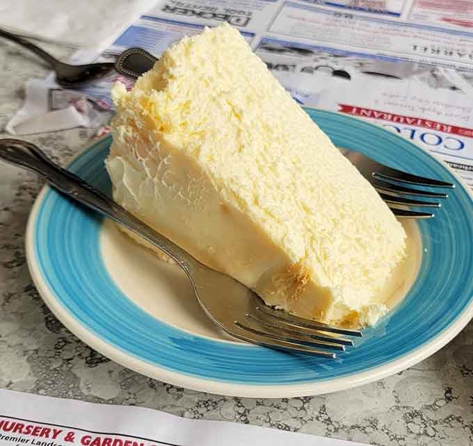 That towering slice of cheesecake stands tall and proud, ready to make you forget about any diet resolutions.