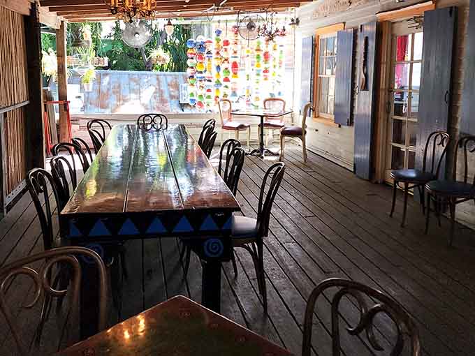 Long communal tables under colorful chandeliers turn breakfast into a party you didn't know you needed to attend.