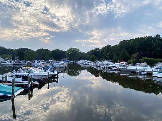 The mirror-like water reflects dramatic clouds, creating a scene worthy of framing or at least several Instagram posts.
