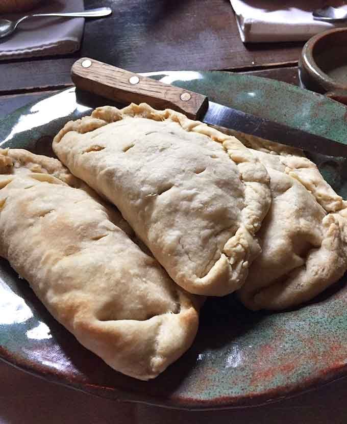 Golden pastries stuffed with savory filling—because medieval cooks invented the original Hot Pocket, basically.
