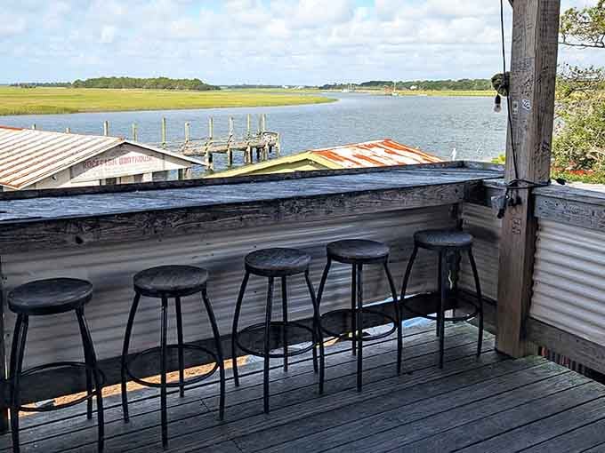 Bar seating overlooking the water where you can watch boats drift by while contemplating whether to order another round of oysters.