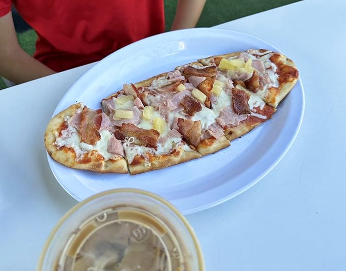 Flatbread pizza topped with bacon and pineapple because apparently breakfast can also moonlight as Hawaiian vacation vibes.