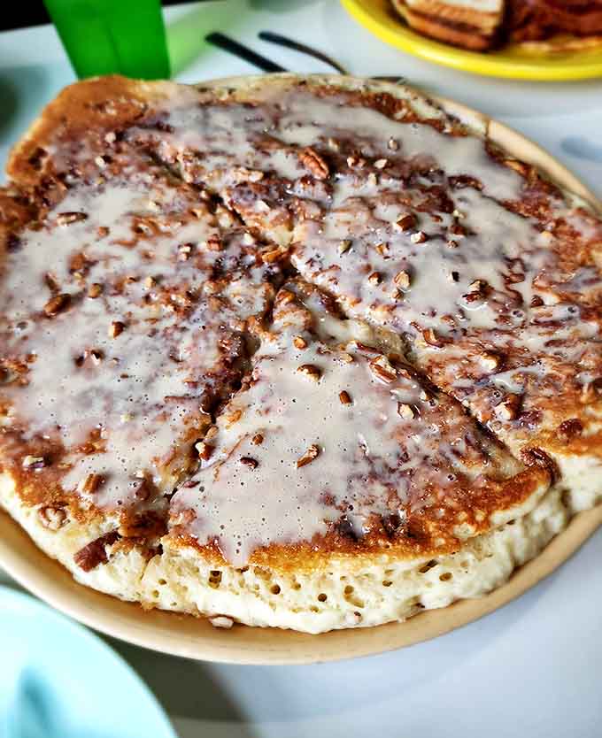 This maple pecan sticky bun pancake drizzled with glaze could make a grown person reconsider their life priorities.