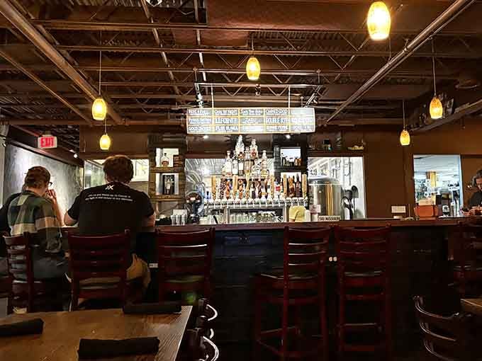 The bar area where brewing magic happens, complete with tap handles representing their rotating selection.