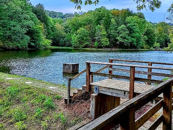 The lake's mirror-perfect surface reflects the surrounding forest like nature's showing off its best work here.