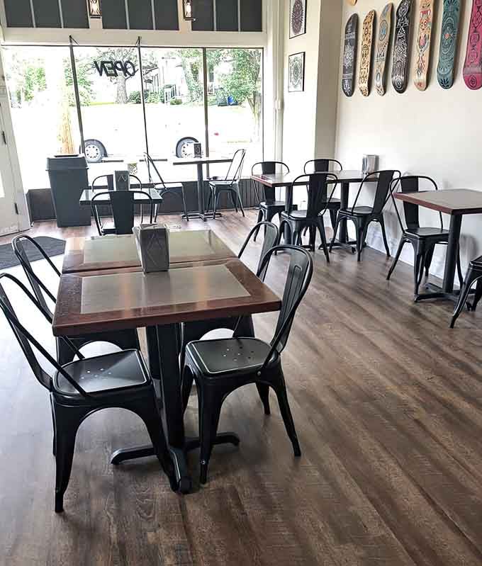 Metal chairs, wood tables, and skateboard art create a relaxed vibe for serious eating.