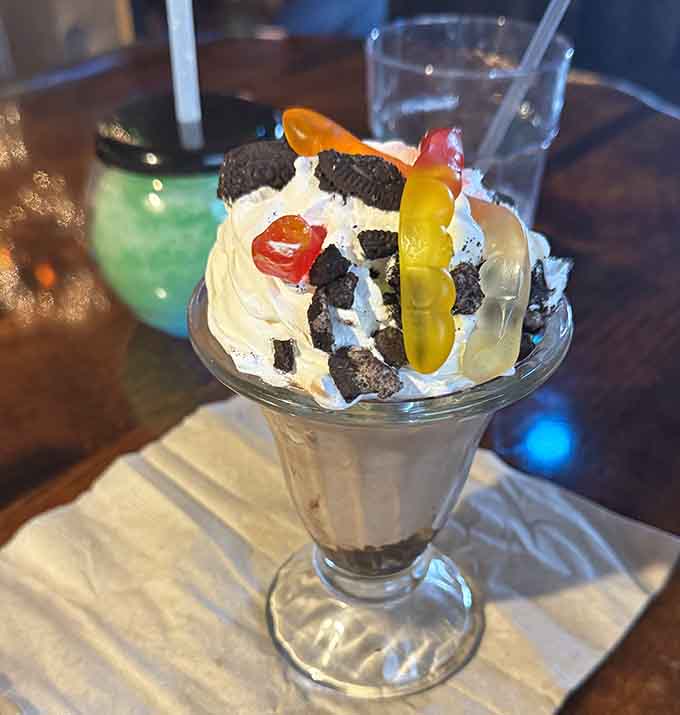 When your sundae arrives looking like a gummy worm survived an Oreo avalanche, you know dessert will be memorable.