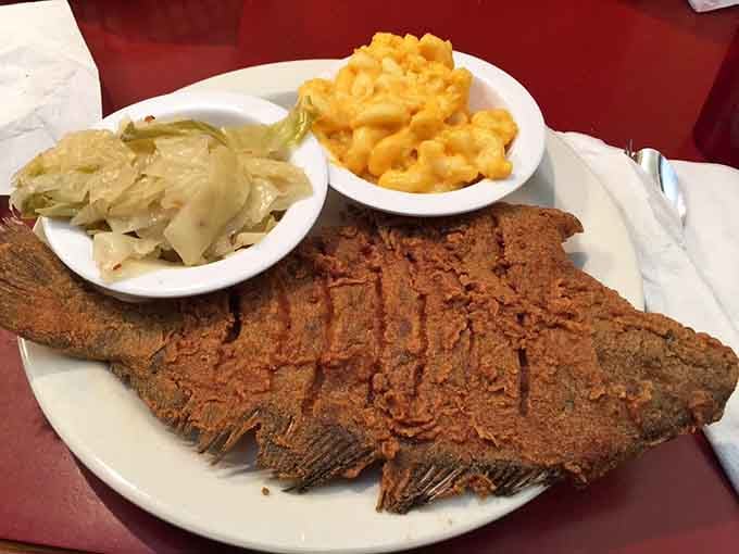 Fried flounder so large it hangs off the plate, served with cabbage and mac and cheese perfection.