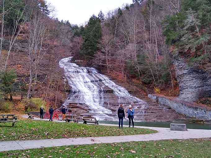 The main falls in winter stillness draw admirers who appreciate beauty even when swimming season has packed its bags.