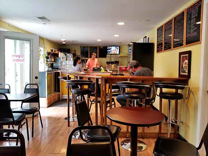 Cozy seating, menu boards overhead, and that welcoming glow that says "sit down, relax, we've got you covered today."