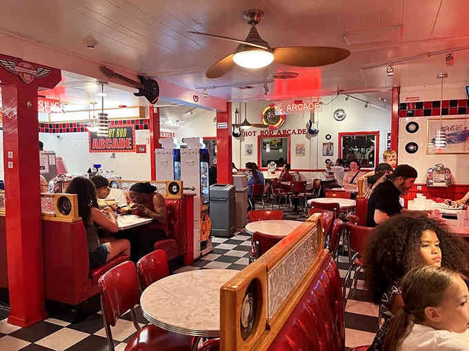 Red booths filled with happy diners prove that good food and great atmosphere never go out of style.