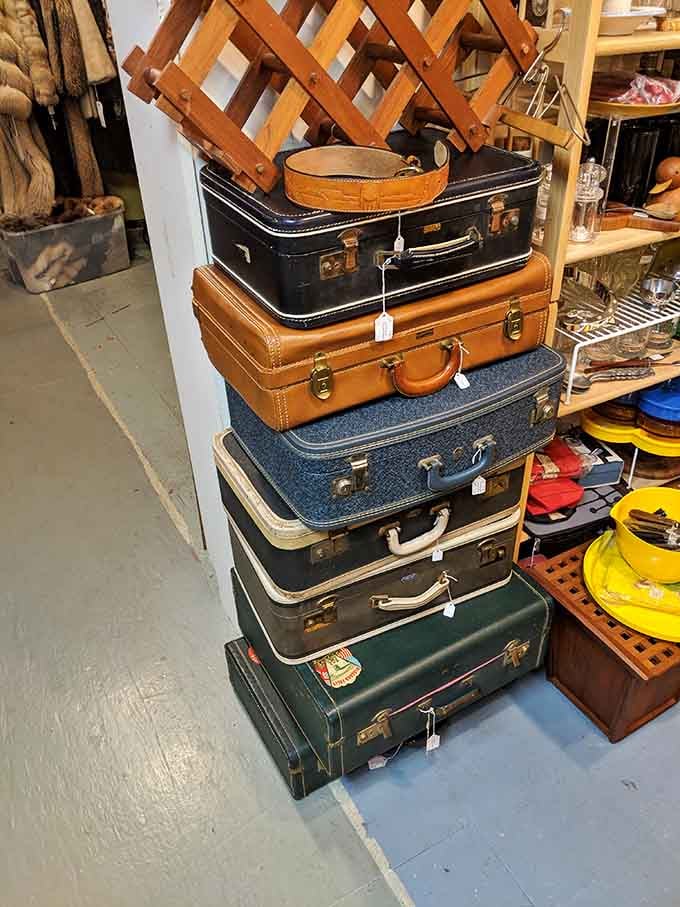 Stacked vintage suitcases that traveled the world before TSA existed, now perfect for storage or pure nostalgic decoration.