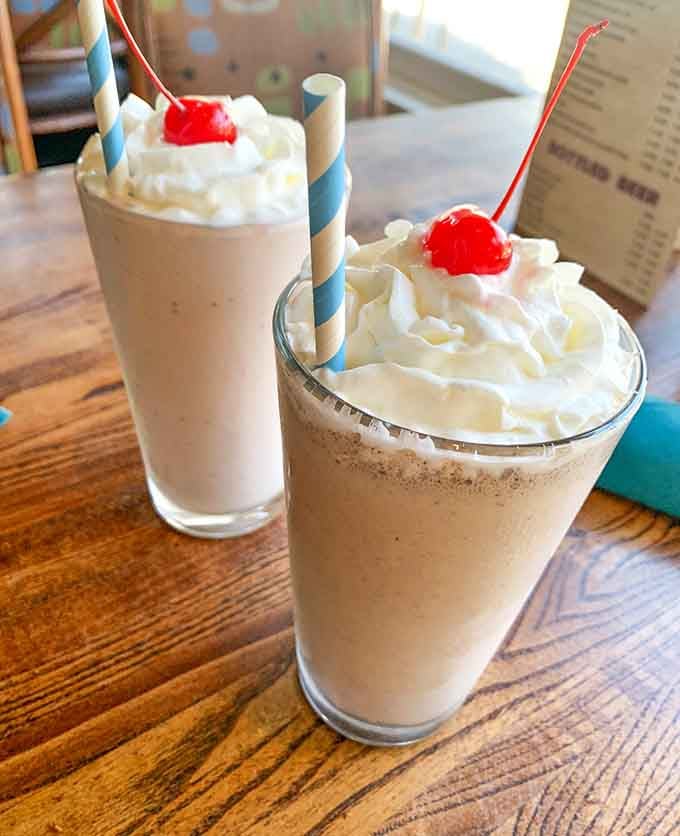 Milkshakes topped with whipped cream and cherries channel pure nostalgia, like your childhood soda fountain grew up and moved to Hawaii.