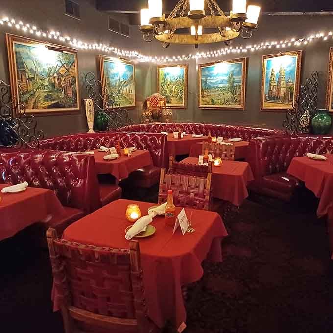 Candlelit tables and vintage paintings set the stage for evenings that feel special without trying too hard.