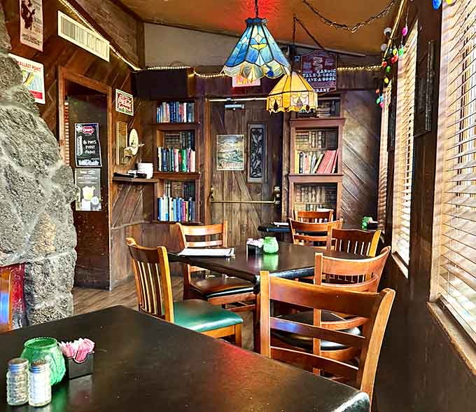 Tiffany lamps and bookshelves in a bar, because sophistication and spirits have always been good friends.