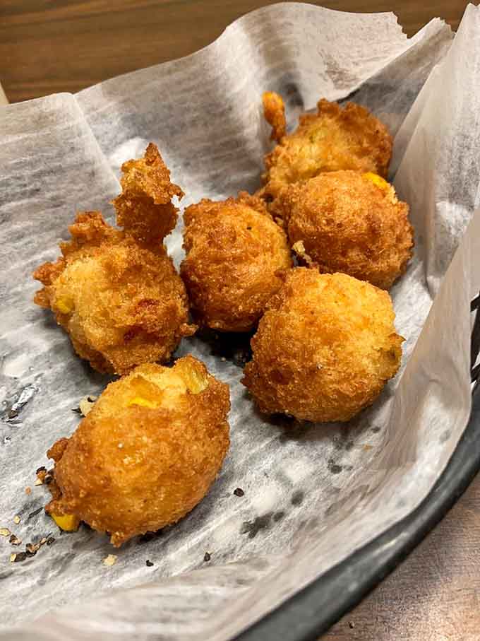 Hushpuppies so perfectly golden and crispy, they could make a grown person weep tears of joy into their sweet tea.