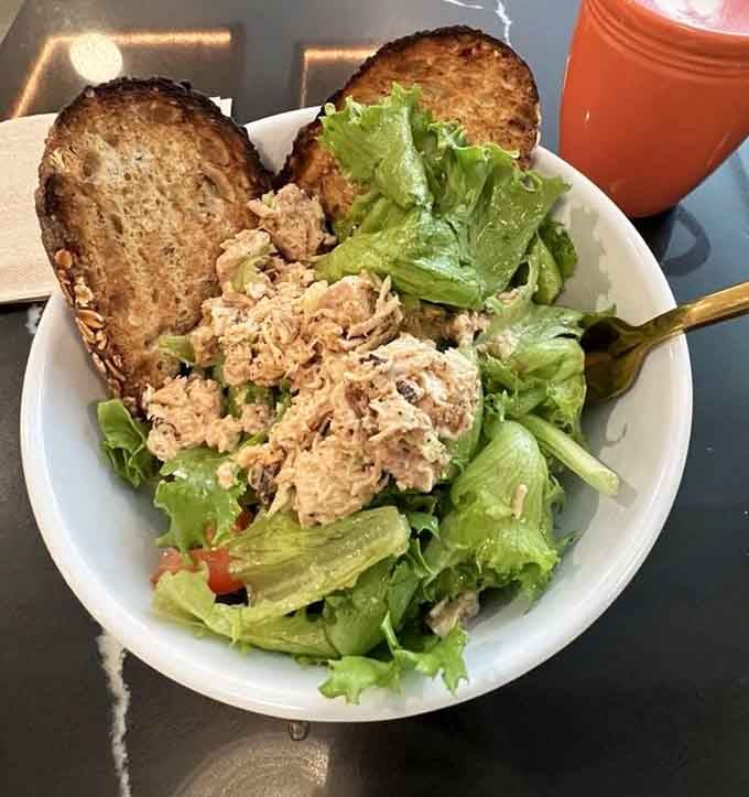 Grandma's Chicken Salad served fresh with greens and toast, comfort food that actually tastes as good as it looks.