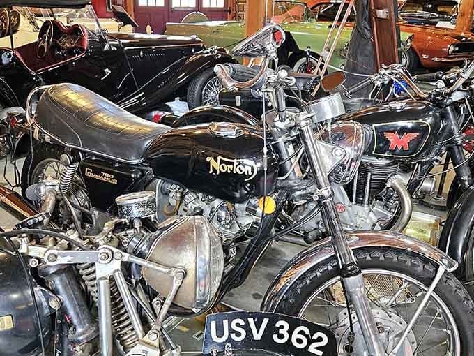 Classic motorcycles share space with their four-wheeled cousins, proving two wheels deserve equal billing in automotive history.