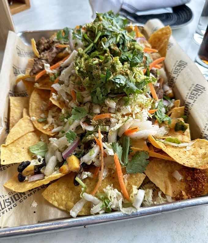 Nachos piled high with toppings that create a delicious architectural marvel you'll happily demolish one chip at a time.