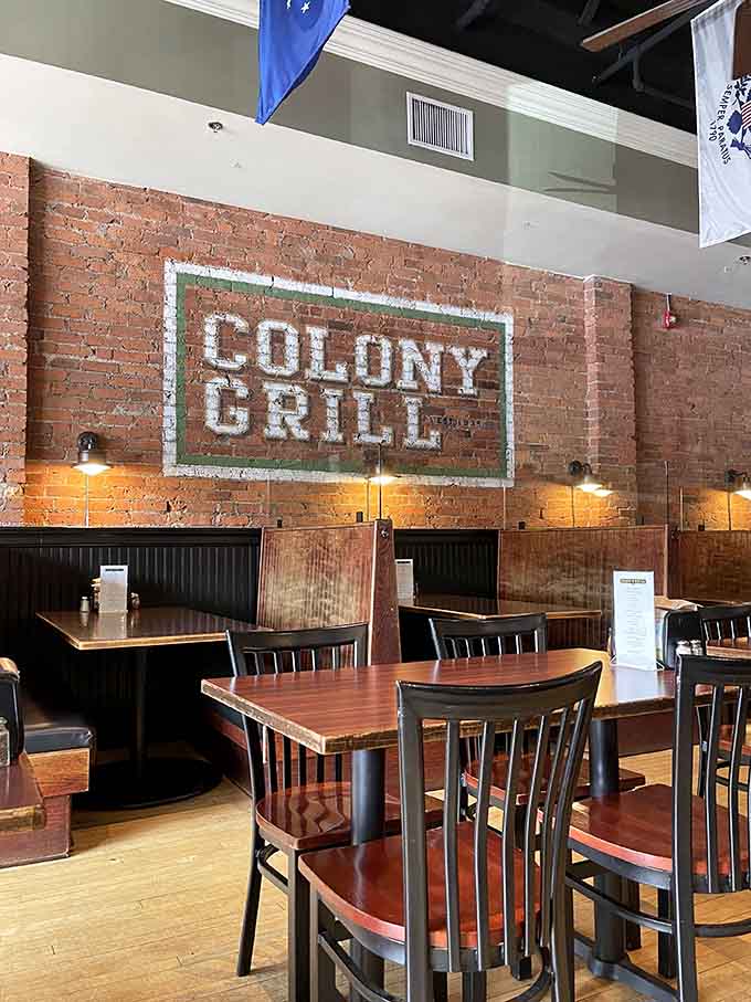 Exposed brick walls and booth seating create that classic pizzeria atmosphere where memories are made over pies.