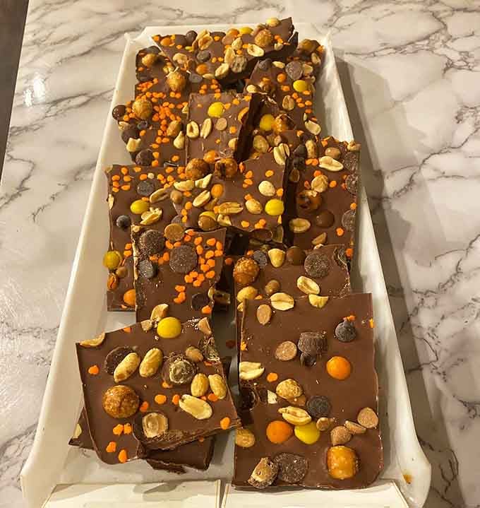 This peanut butter bark loaded with candy and peanuts is what happens when chocolate stops playing it safe.