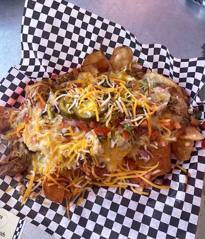 Nachos loaded with enough toppings to require an engineering degree just to figure out where to start eating.