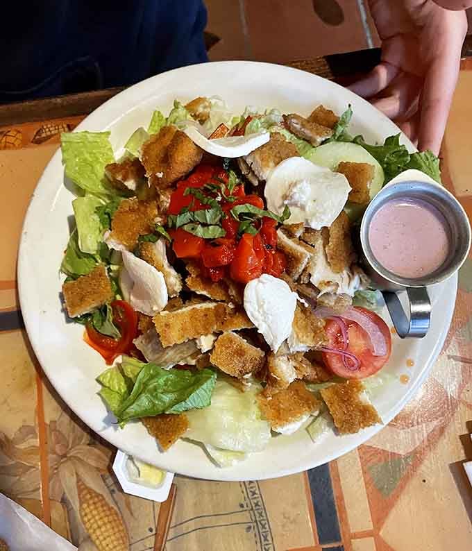 A salad so loaded with toppings and crispy chicken that calling it "just a salad" feels criminal.