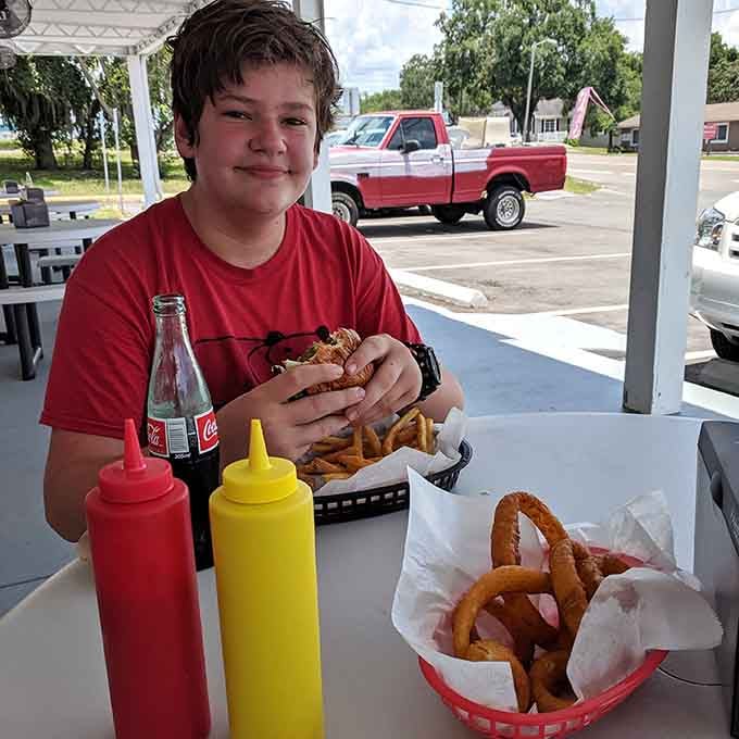 Happiness is a basket of onion rings, a loaded burger, and a classic Coke at this beloved Palm Harbor gem.