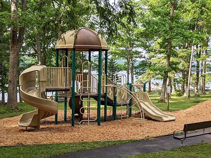 Even the playground gets a million-dollar view, because kids deserve lakeside scenery while they swing.