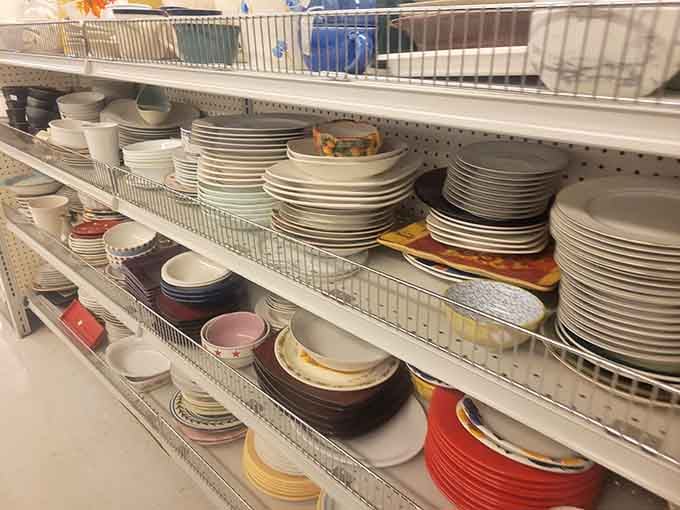 Stacks of plates and bowls prove that mismatched dinnerware is actually a lifestyle choice, not a mistake.