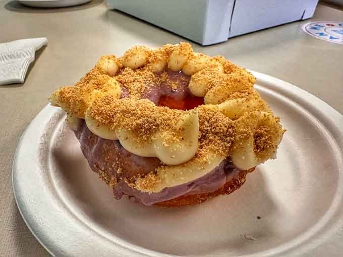 The blueberry cheesecake donut stacked high with frosting and graham cracker crumbs, because going halfway never made anyone truly happy.