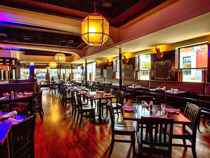 Rich mahogany tones and soft lighting create the kind of ambiance where every meal feels like a celebration.