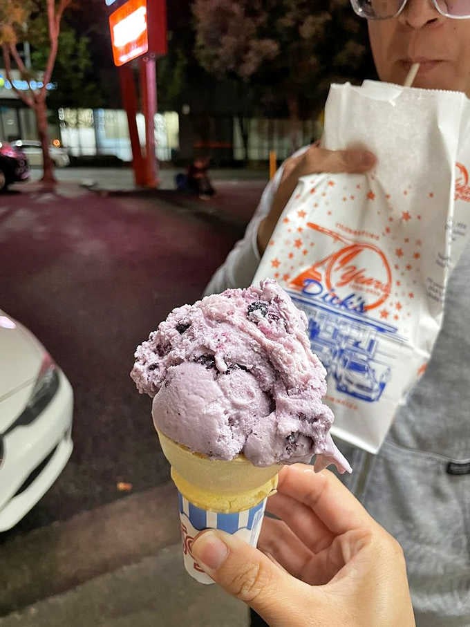 Huckleberry ice cream that's basically summer in the Pacific Northwest, frozen and served in a cone.