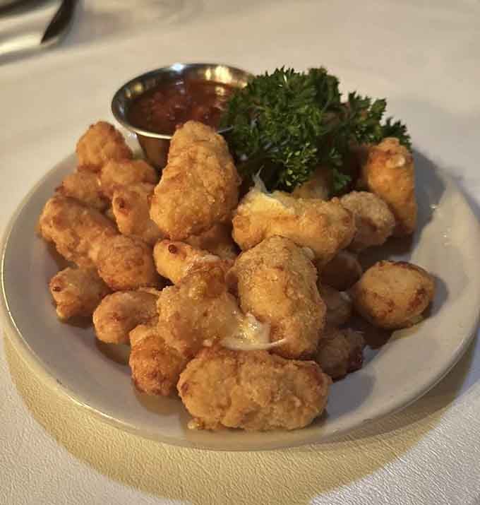 Golden, crispy cheese curds that squeak when you bite them, because this is Wisconsin and we do things right.
