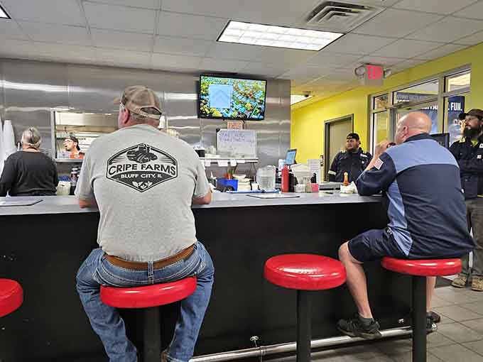 Counter seating where strangers become friends over coffee refills and shared appreciation for honest cooking.
